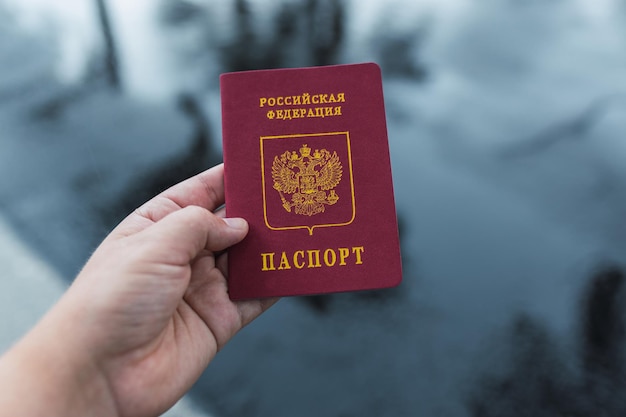 Premium Photo Human Hand Holding A Red Russian Passport