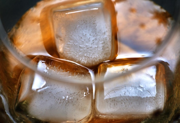 Premium Photo | Ice cubes in a glass of water Premium Photo | Ice cubes in a glass of water