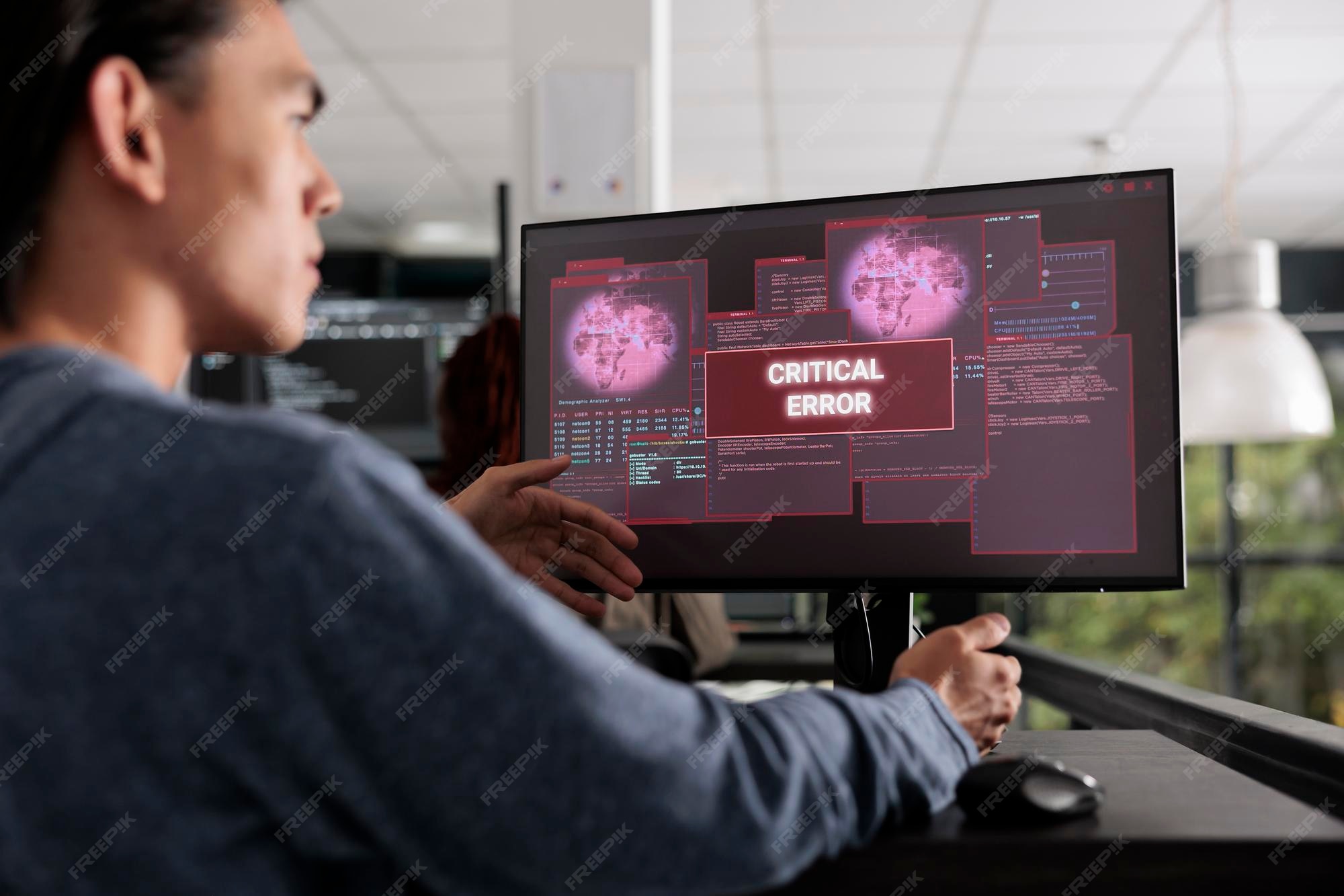 Premium Photo | It programmer reading system error message on computer monitor, trying to solve ...