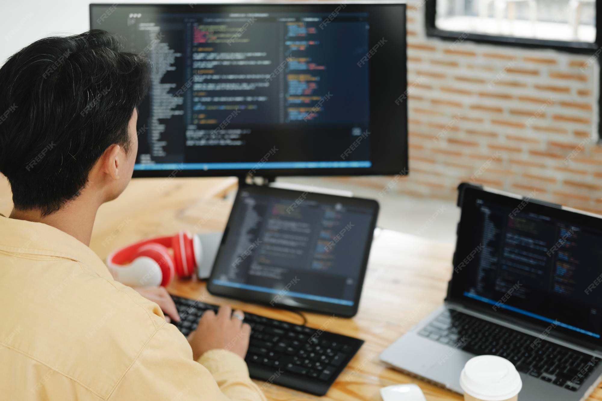 Premium Photo | It programmer starts working on desktop computer the website developer software ...