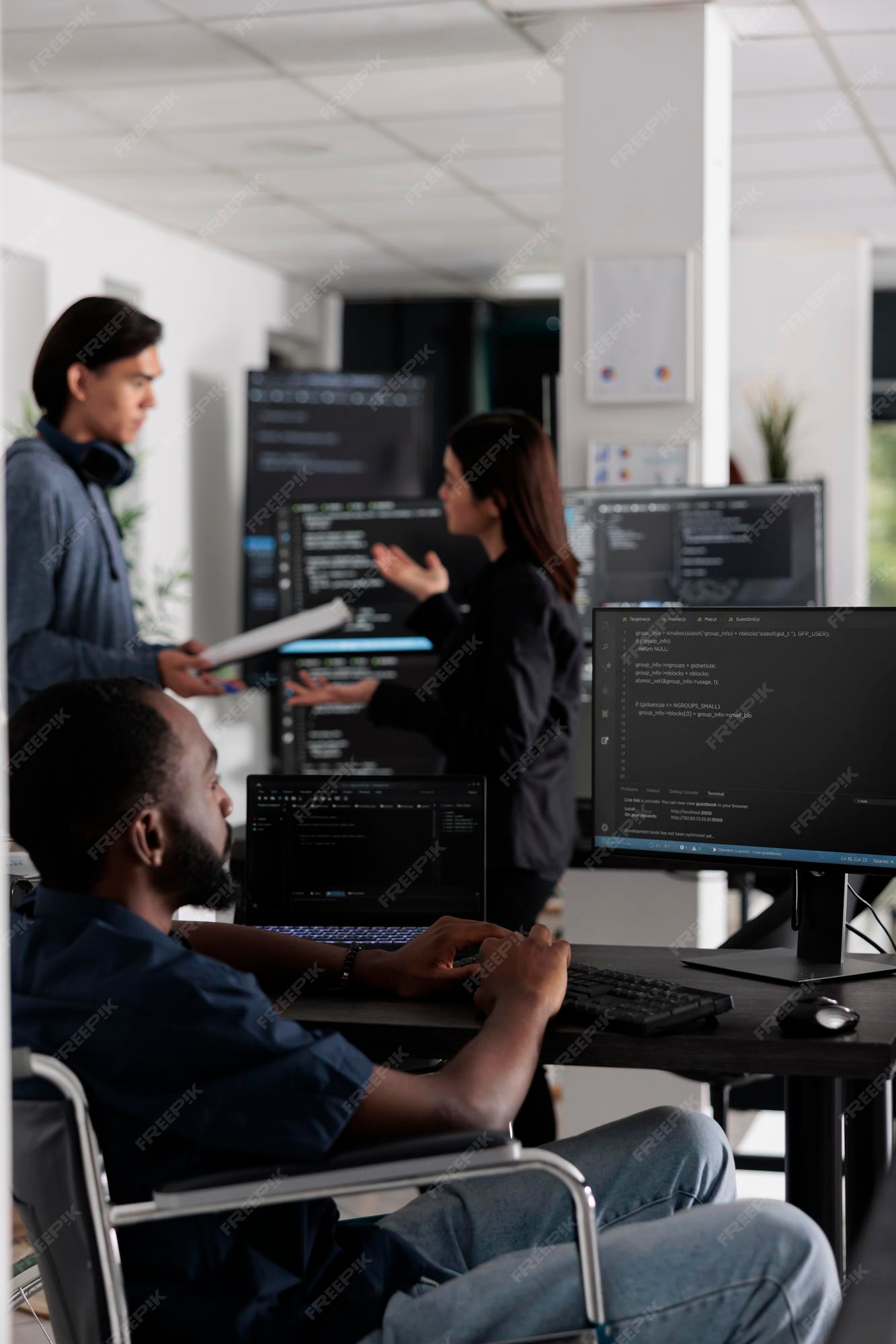 Premium Photo | It programmer in wheelchair typing html code in coding office, working on server ...