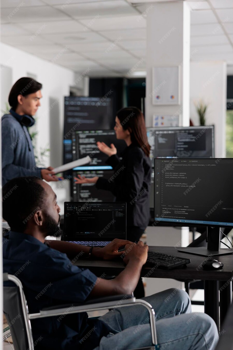 Premium Photo | It programmer in wheelchair typing html code in coding office, working on server ...