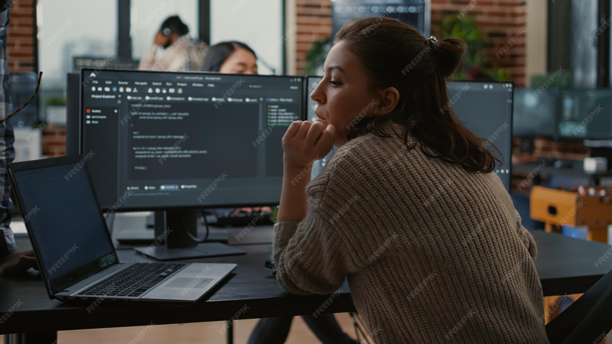 Premium Photo | Junior developer putting laptop with source code on ... Premium Photo | Junior developer putting laptop with source code on ...