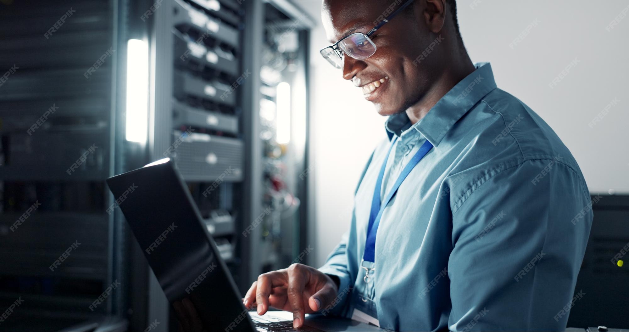 Premium Photo | Laptop server room and black man on database network for maintenance programming ...