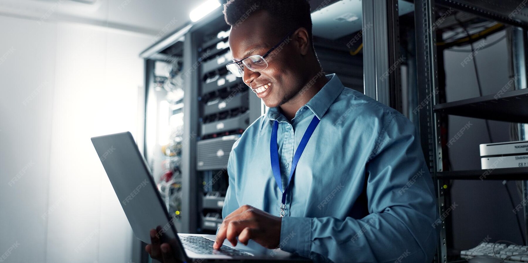 Premium Photo | Laptop server room and black man on network for database maintenance programming ...