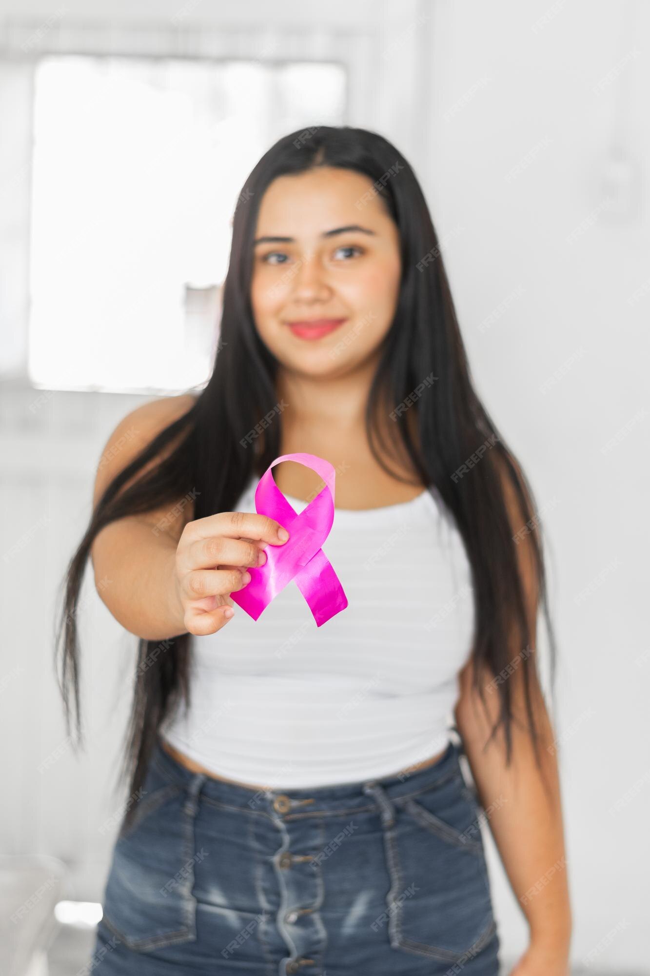 Premium Photo Latin Brunette Woman Holding In Her Hand A Pink Ribbon