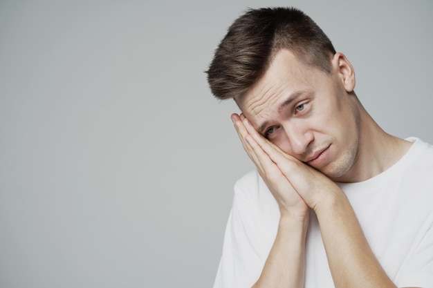Premium Photo | A lazy young man wakes up early in the morning looking ... Premium Photo | A lazy young man wakes up early in the morning looking ...