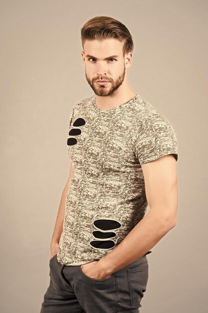 Premium Photo Macho With Beard In Tshirt Pose With Hands In Pockets