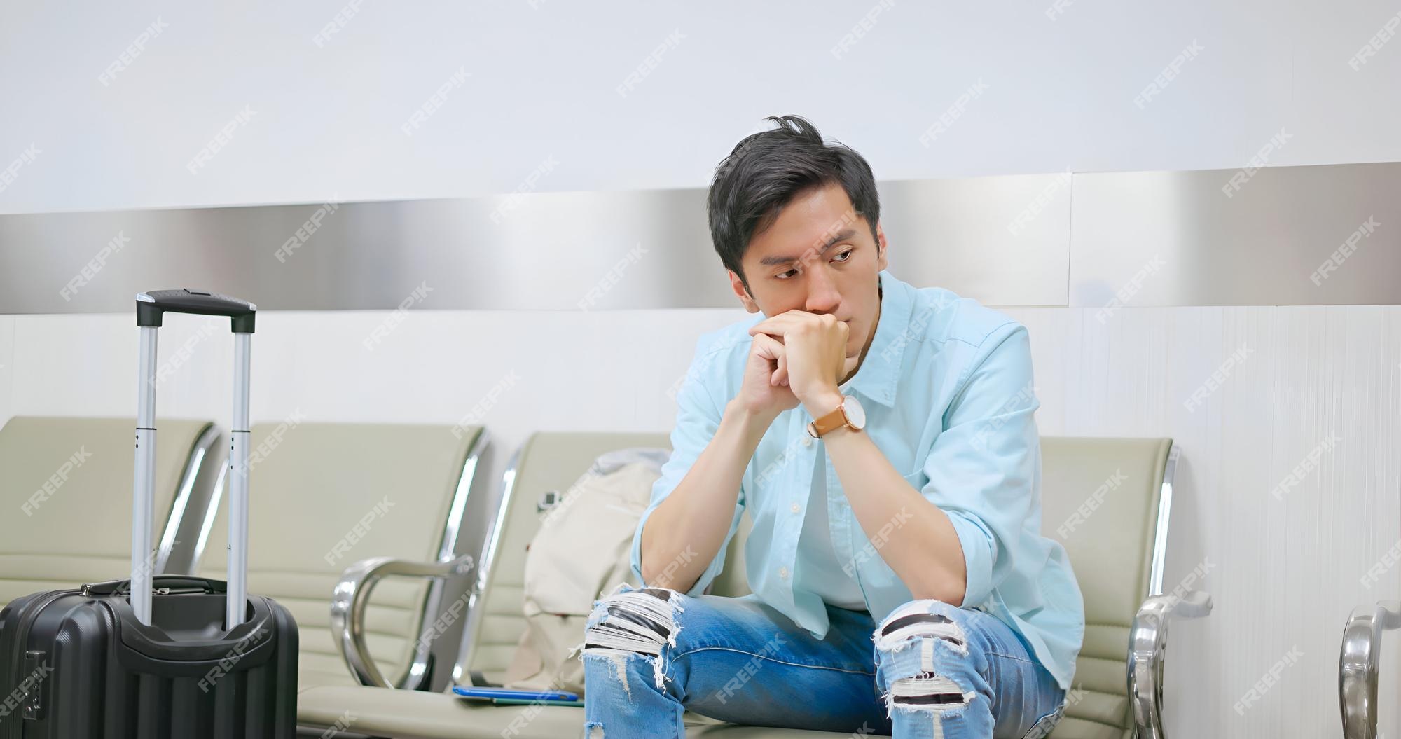 Premium Photo | Male anxiously waiting at airport Premium Photo | Male anxiously waiting at airport