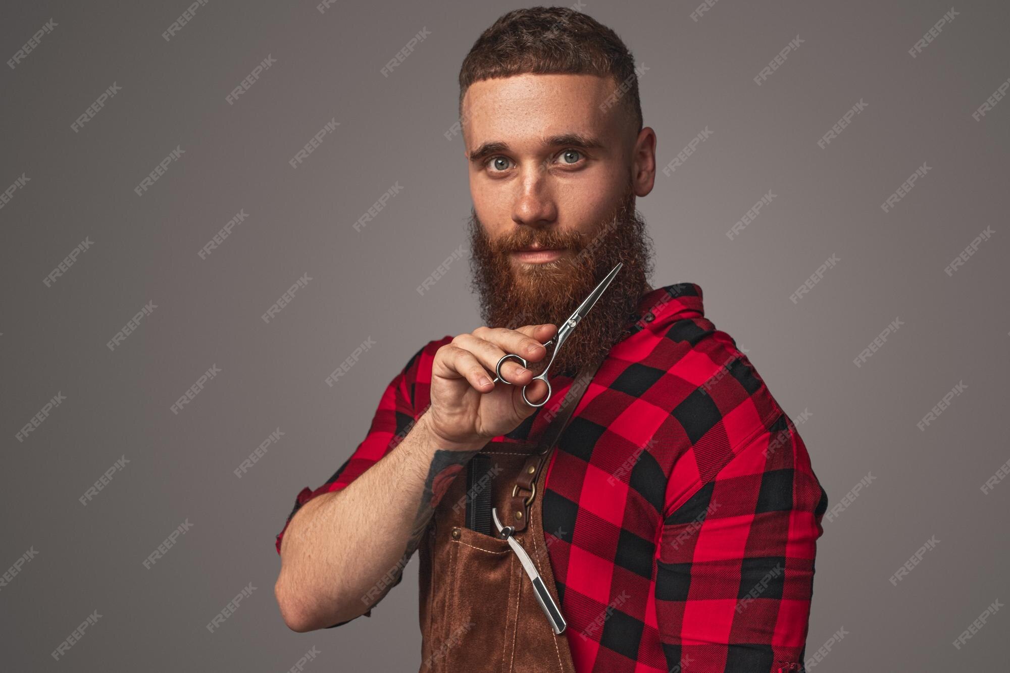 Premium Photo Male Barber Trimming Beard With Scissors