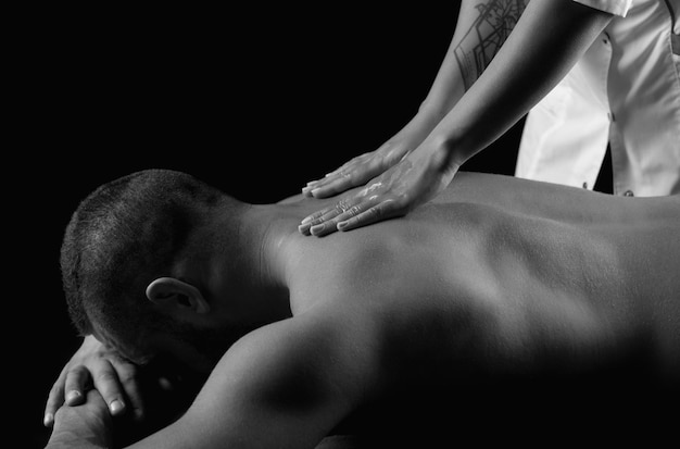 Premium Photo Man Back Massage From Masseur Massage On The Back Male Getting Relax Massage On