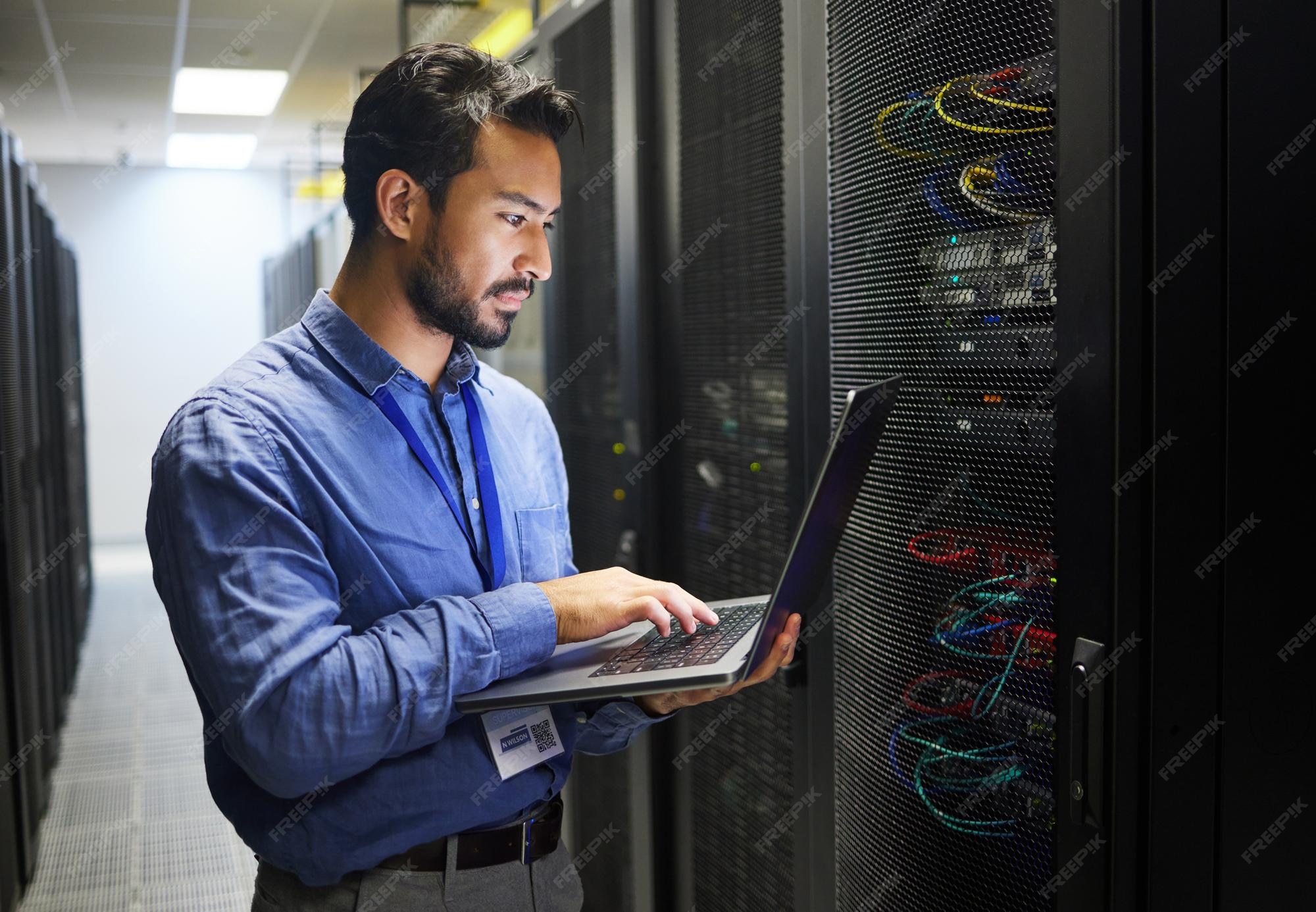 Premium Photo Man Engineering Laptop And Data Center Server Room Inspection Or System Solution 