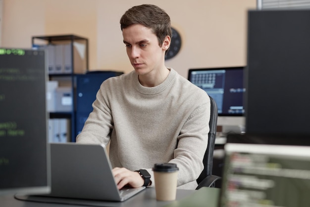 Premium Photo | Man programmer using laptop Premium Photo | Man programmer using laptop