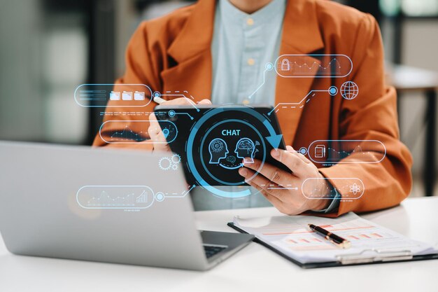 Premium Photo | Man using chatbot in computer and tablet smart intelligence aichat with ai ...