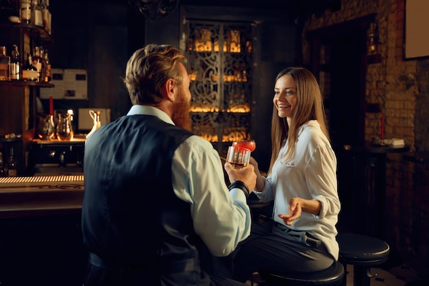 Premium Photo | Man and woman having nice conversation at bar counter Premium Photo | Man and woman having nice conversation at bar counter