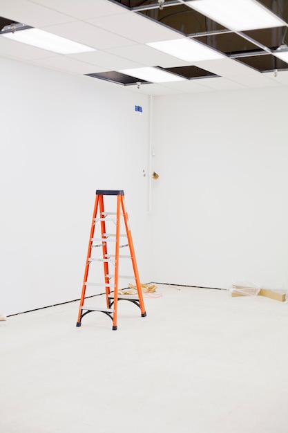 Premium Photo | Metallic structure against orange wall in building Premium Photo | Metallic structure against orange wall in building