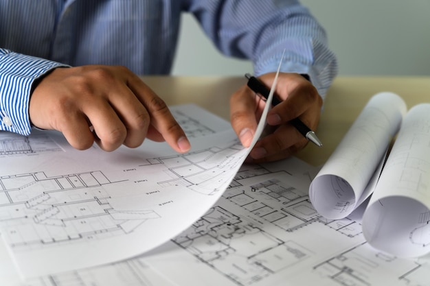 Premium Photo | Midsection of architect holding blueprint Premium Photo | Midsection of architect holding blueprint