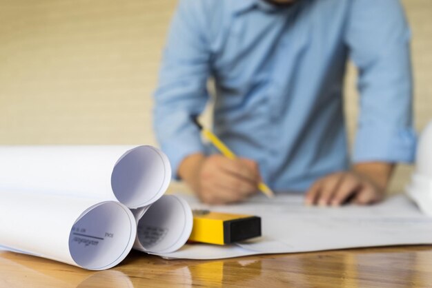 Premium Photo | Midsection of architect preparing blueprint on desk at ... Premium Photo | Midsection of architect preparing blueprint on desk at ...