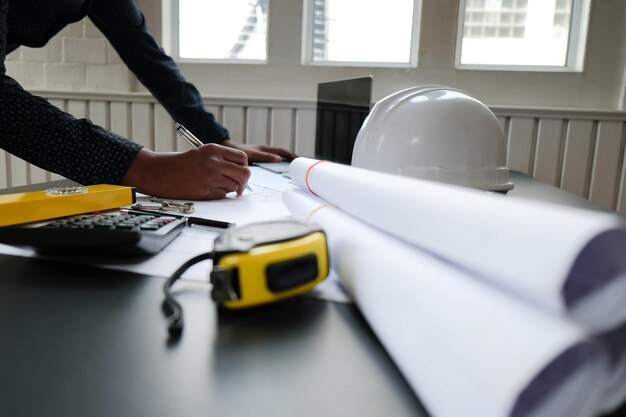 Premium Photo | Midsection of architect preparing blueprint on desk Premium Photo | Midsection of architect preparing blueprint on desk