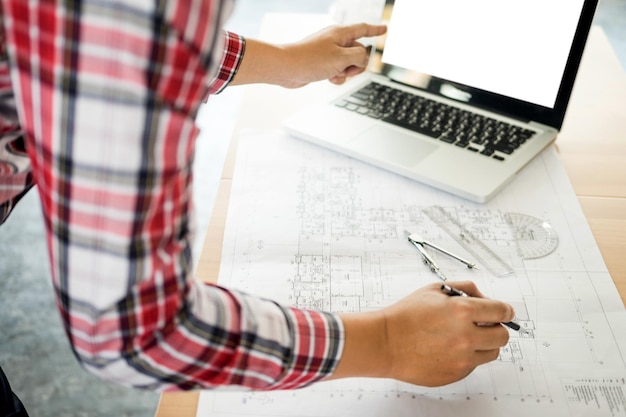 Premium Photo | Midsection of architect working in office Premium Photo | Midsection of architect working in office