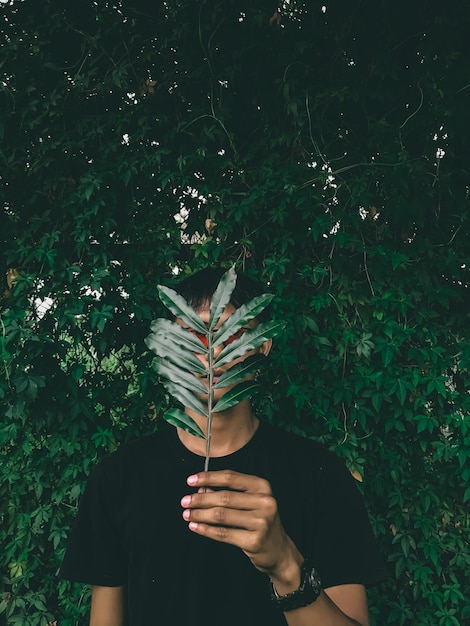 Premium Photo | Midsection of person holding plant Premium Photo | Midsection of person holding plant