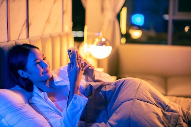 Premium Photo Midsection Of Woman Lying Down On Bed