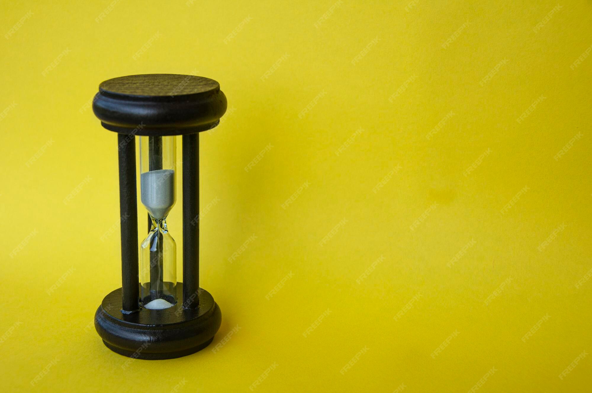 Premium Photo Minute Glass Isolated On Yellow Background Copy Space Concept