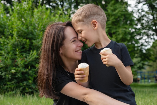 Premium Photo Mom And Son Eat Ice Cream In The Park