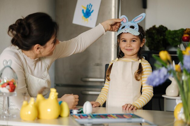 Premium Photo | Mom take off the easter bunny mask from her daughters ... Premium Photo | Mom take off the easter bunny mask from her daughters ...