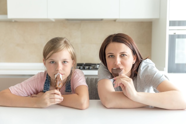 Premium Photo Mother And Daughter Eating Ice Cream At Home