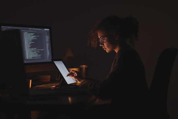 Premium Photo | Nighttime computer tech and woman working on database programming code stock ...