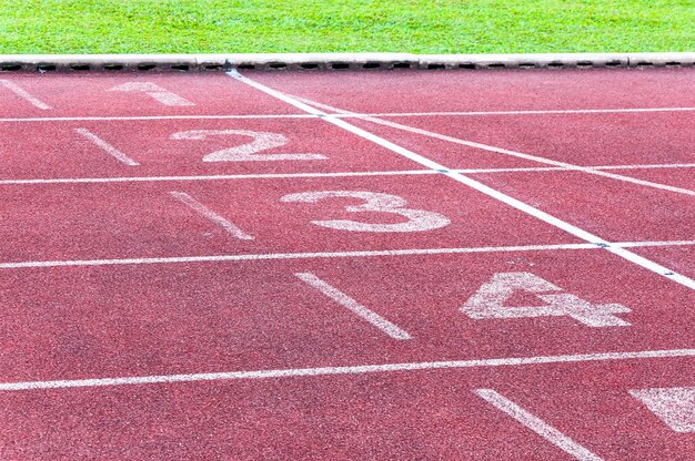 Premium Photo | Numbers starting point on red running trackrunning ... Premium Photo | Numbers starting point on red running trackrunning ...