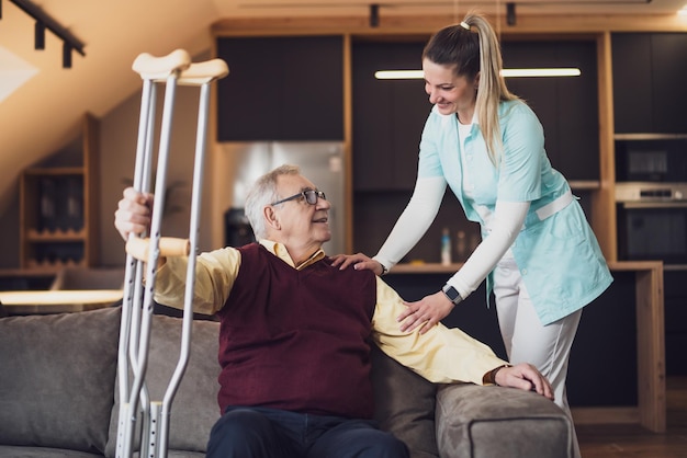 Premium Photo | Nurse home caregiver is assisting old man at his home ... Premium Photo | Nurse home caregiver is assisting old man at his home ...
