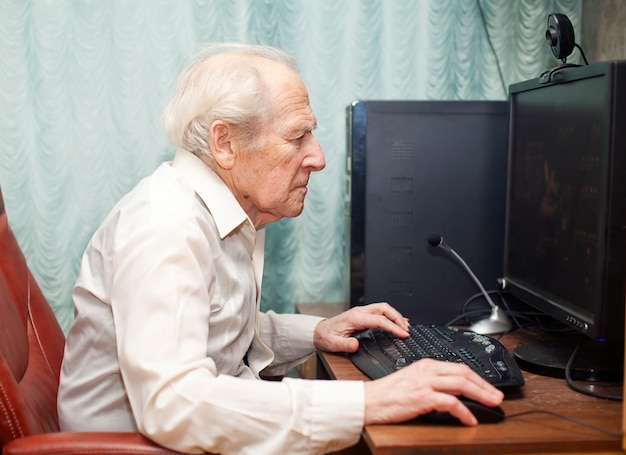 Premium Photo | Old Man Working On Computer Premium Photo | Old Man Working On Computer