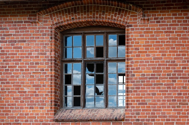 Premium Photo | An old window with broken glass panes in a red brick wall Premium Photo | An old window with broken glass panes in a red brick wall