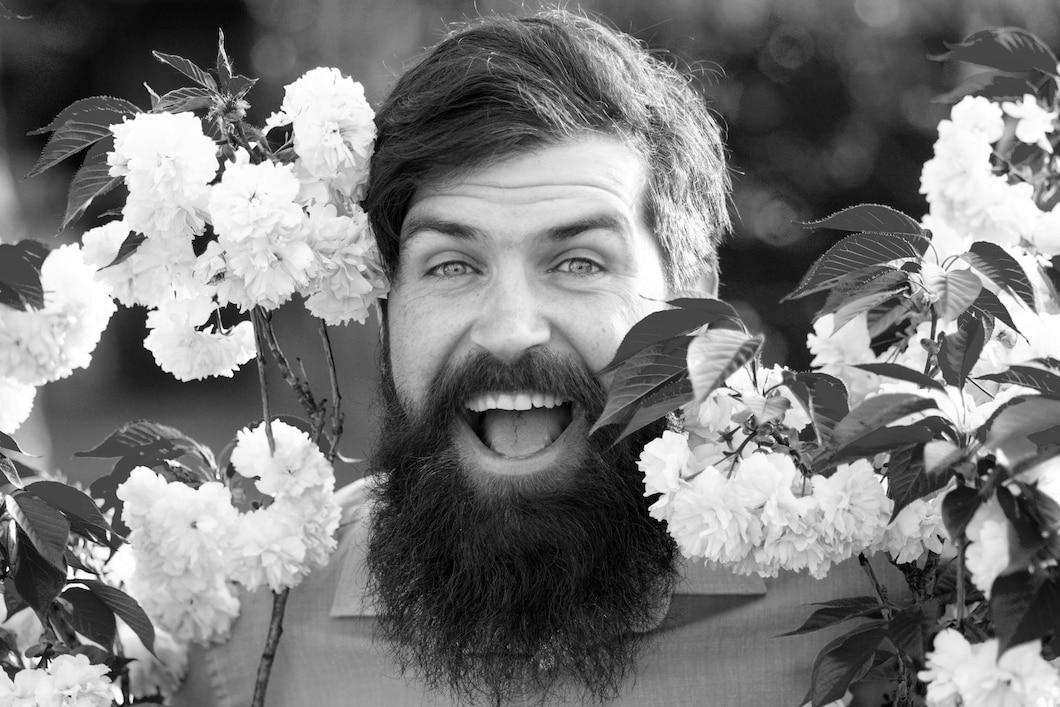 Premium Photo | Outdoor partrait of young man surrounded by flowers ... Premium Photo | Outdoor partrait of young man surrounded by flowers ...