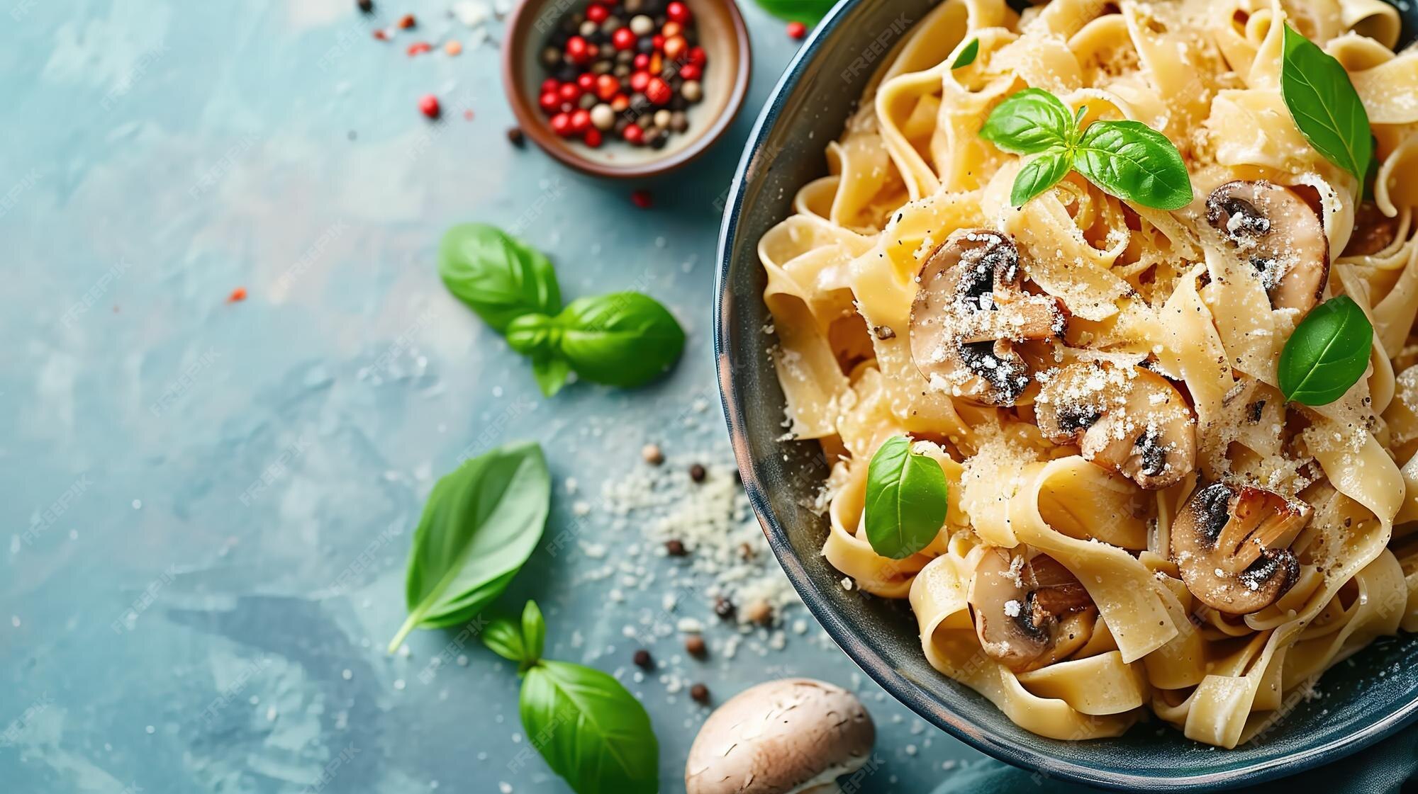 Premium Photo Pasta Mushrooms With Parmesan And Basil On Light Blue Background Copy Space Top View