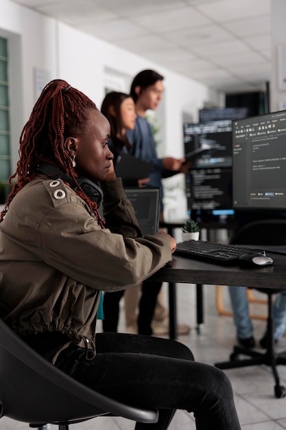 Premium Photo | Pensive african american app developer programming code ... Premium Photo | Pensive african american app developer programming code ...