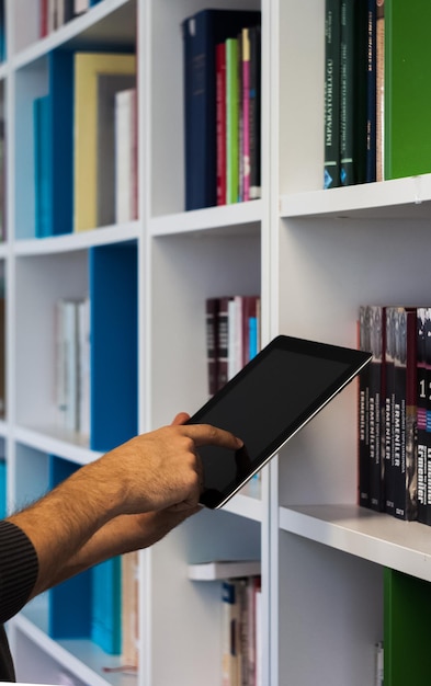 Premium Photo | Person hand holding book Premium Photo | Person hand holding book