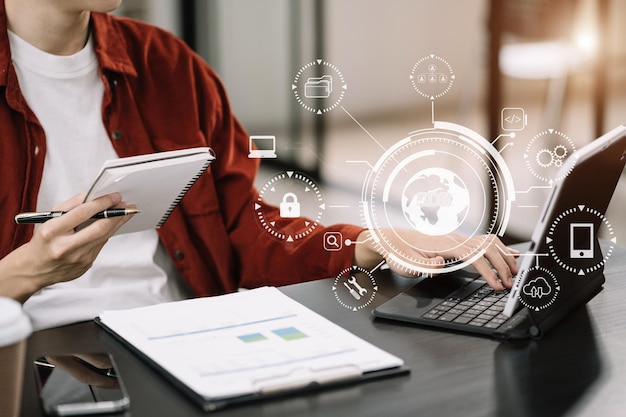 Premium Photo | Person typing laptop computer and tablet with SDK icon ... Premium Photo | Person typing laptop computer and tablet with SDK icon ...