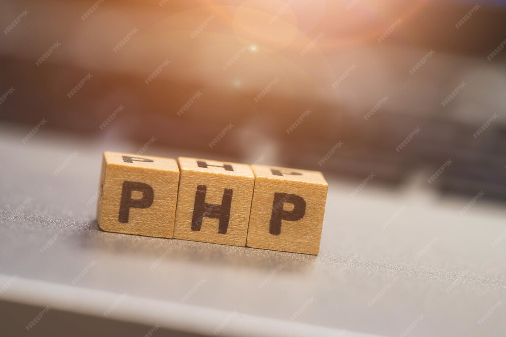 Premium Photo | Php programming web language wooden cubes with letters php lying on a laptop concept