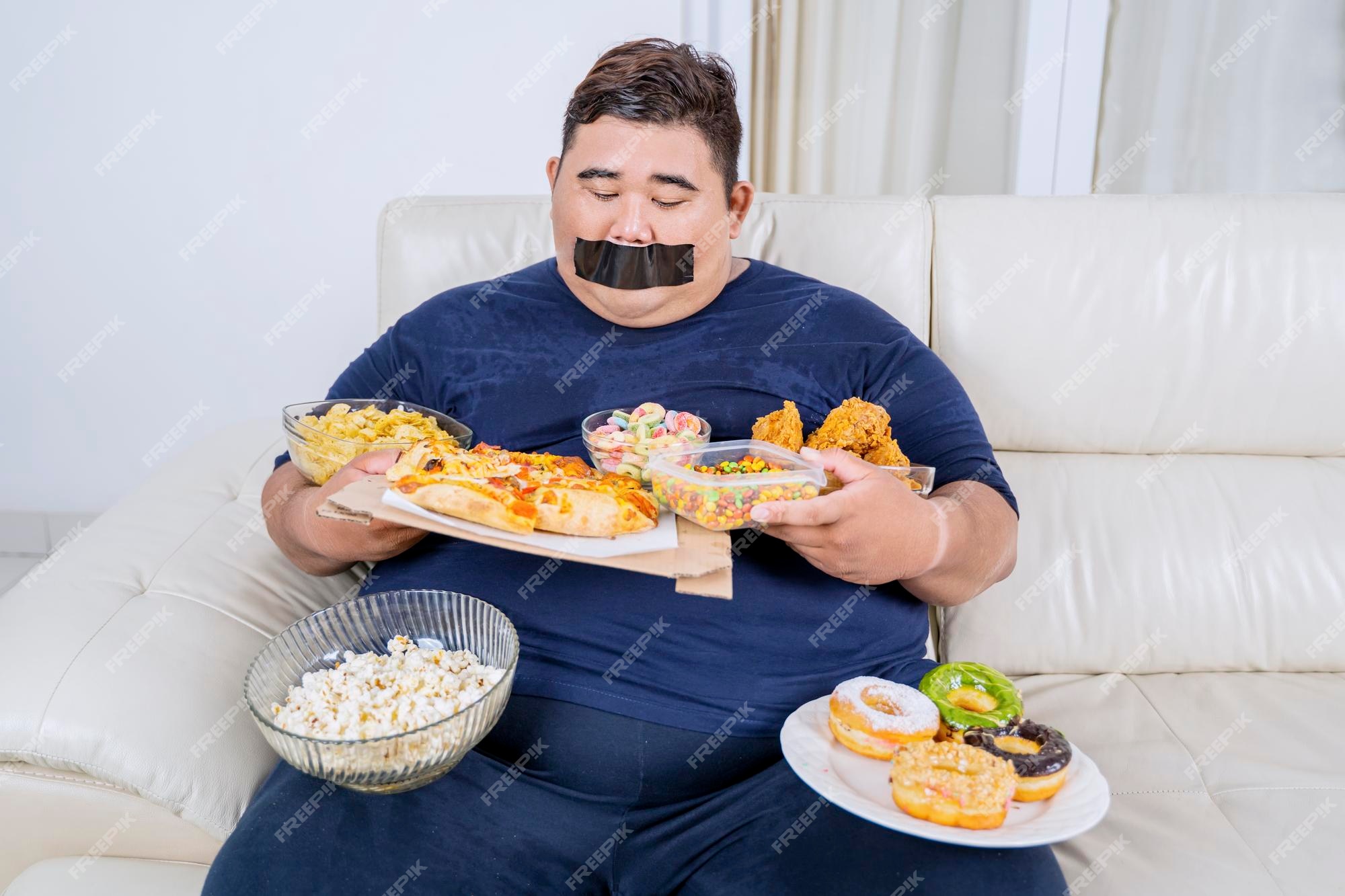 Premium Photo | Portrait of fat sad Asian man taping his mouth Premium Photo | Portrait of fat sad Asian man taping his mouth