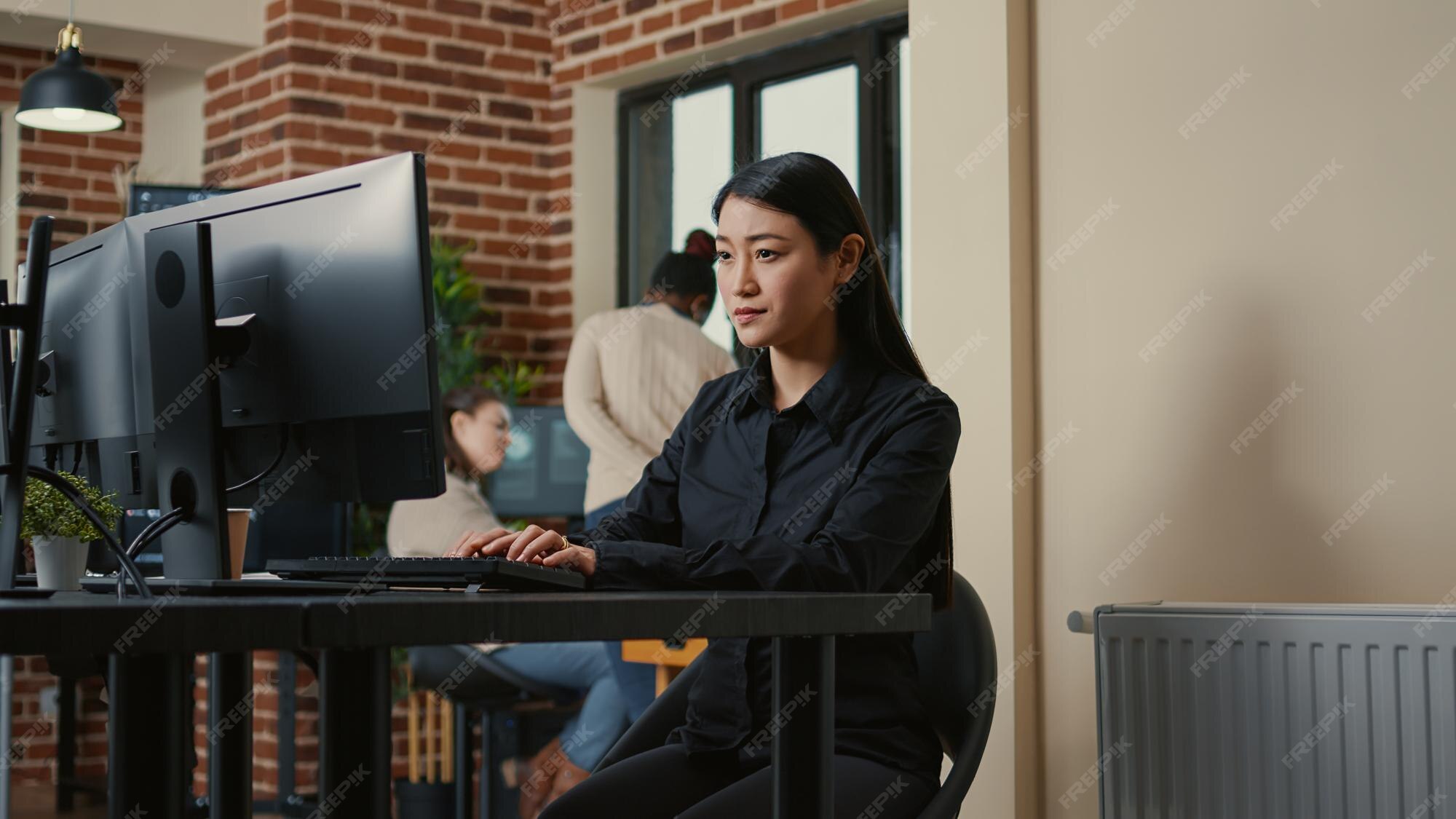 Premium Photo | Portrait of focused system engineer happy with parsing results sitting at desk ...