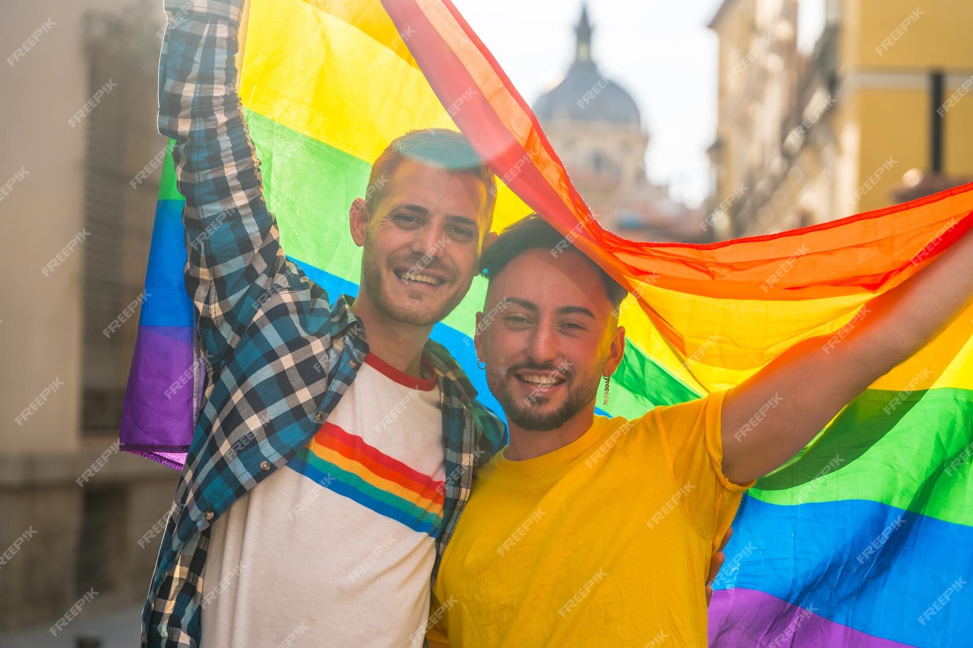 Premium Photo Portrait Of Gay Male Couple With Rainbow Flag At Pride