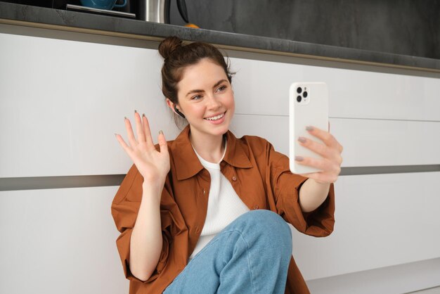 Premium Photo Portrait Of Happy Smiling Woman Video Chats Sits On