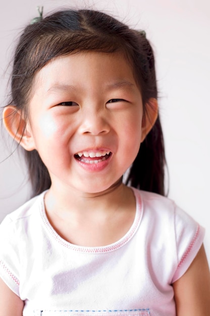 Premium Photo Portrait Of Innocent Girl Against White Background