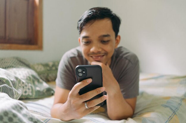 Premium Photo Portrait Of Married Asian Man Holding Smartphone And