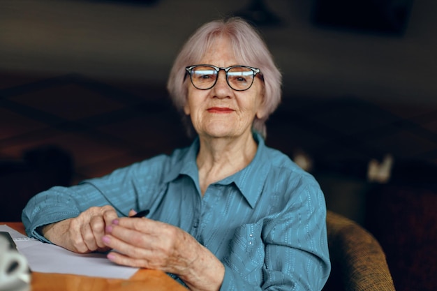 Premium Photo | Portrait of senior woman wearing eyeglasses Premium Photo | Portrait of senior woman wearing eyeglasses