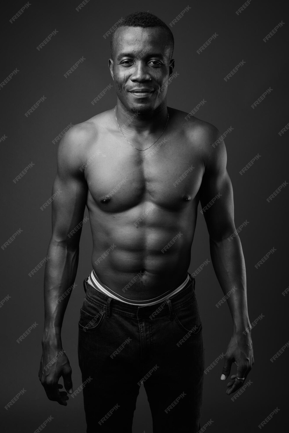 Premium Photo Portrait Of Shirtless Man Against Black Background