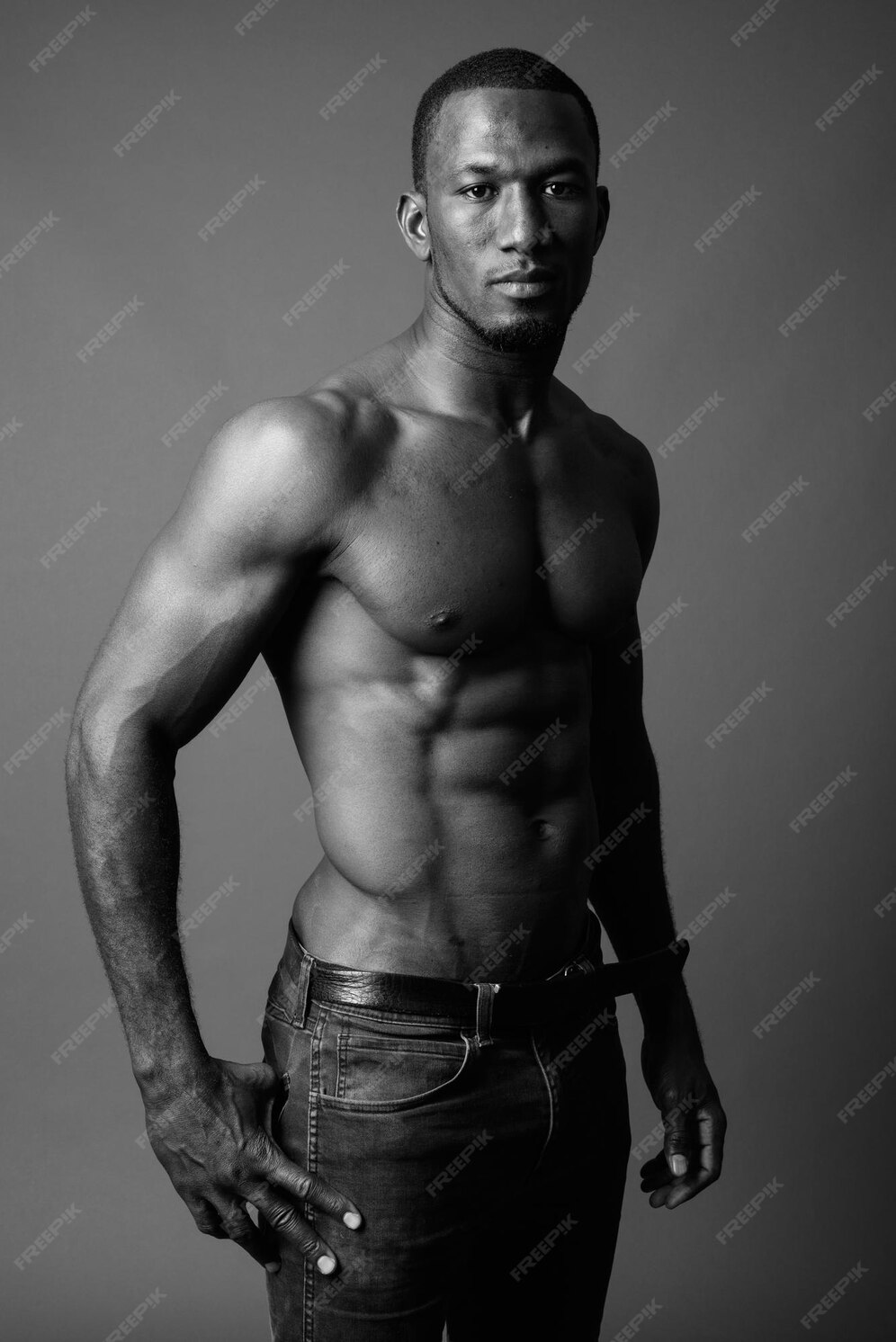 Premium Photo Portrait Of Shirtless Man Standing Against Gray Background